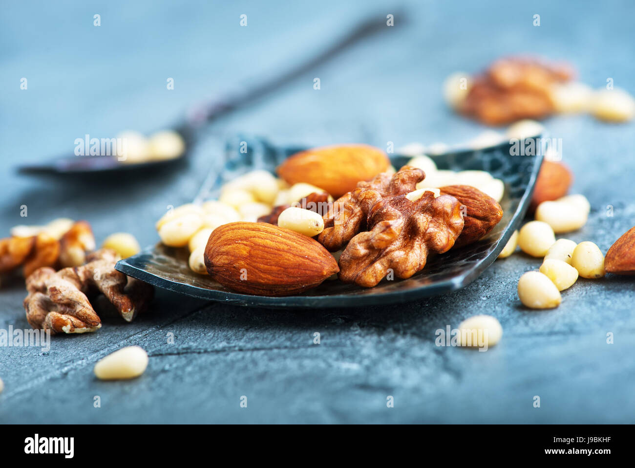 mix of nuts on the plate, stock photo Stock Photo - Alamy