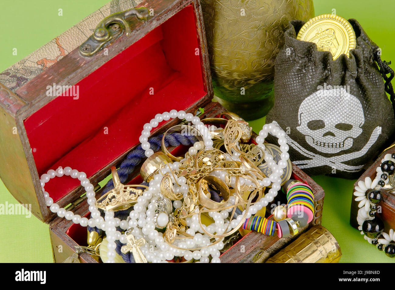 two small boxes with treasures on a light green background Stock Photo ...