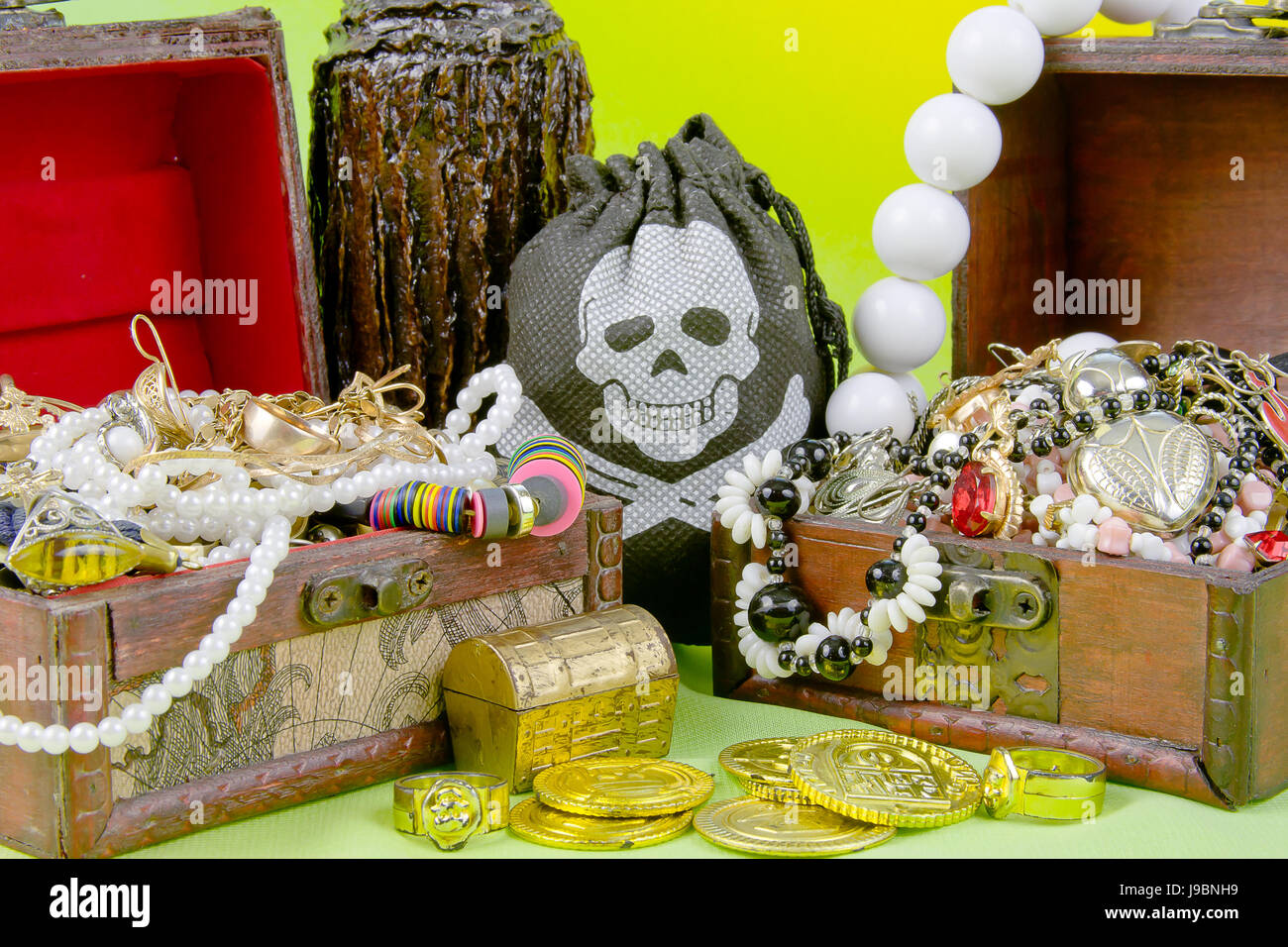 two small boxes with treasures on a light green background Stock Photo ...