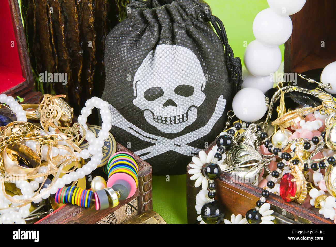 two small boxes with treasures on a light green background Stock Photo ...