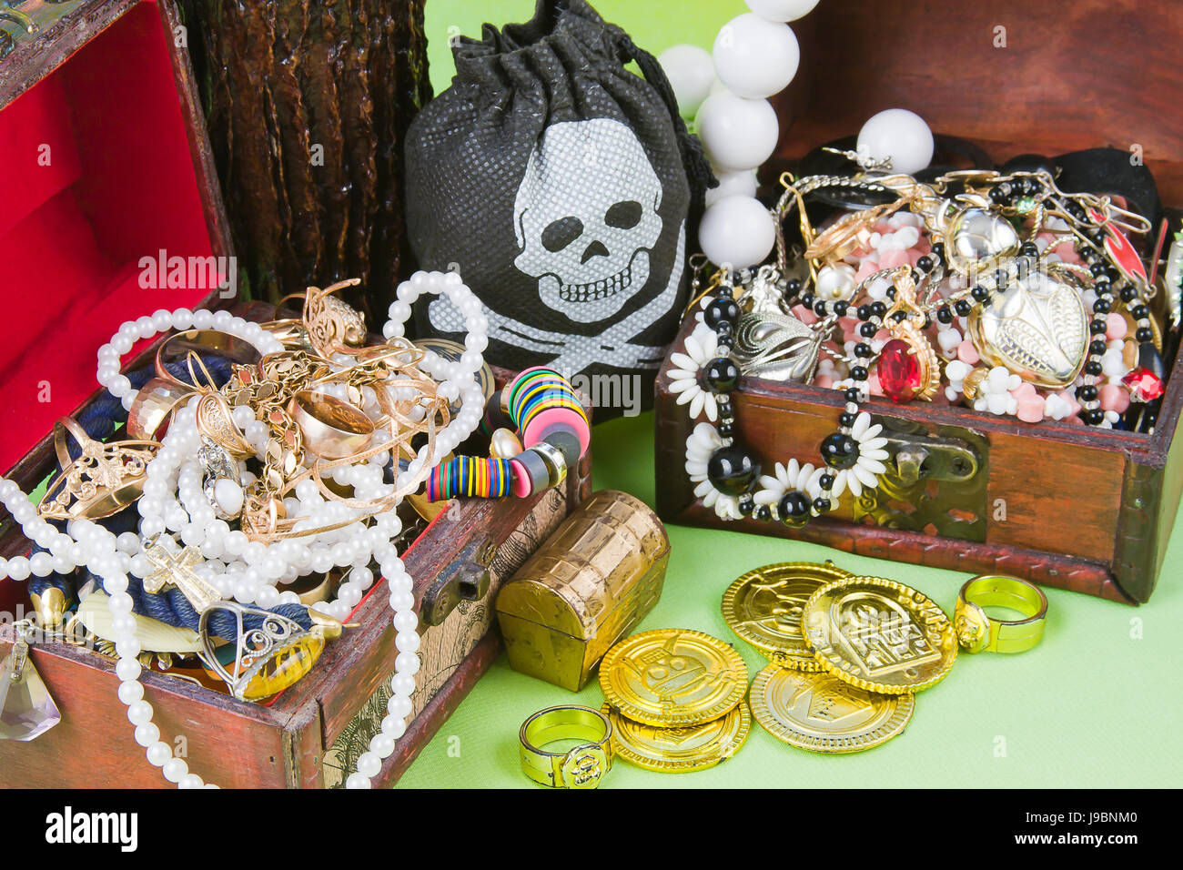 two small boxes with treasures on a light green background Stock Photo ...