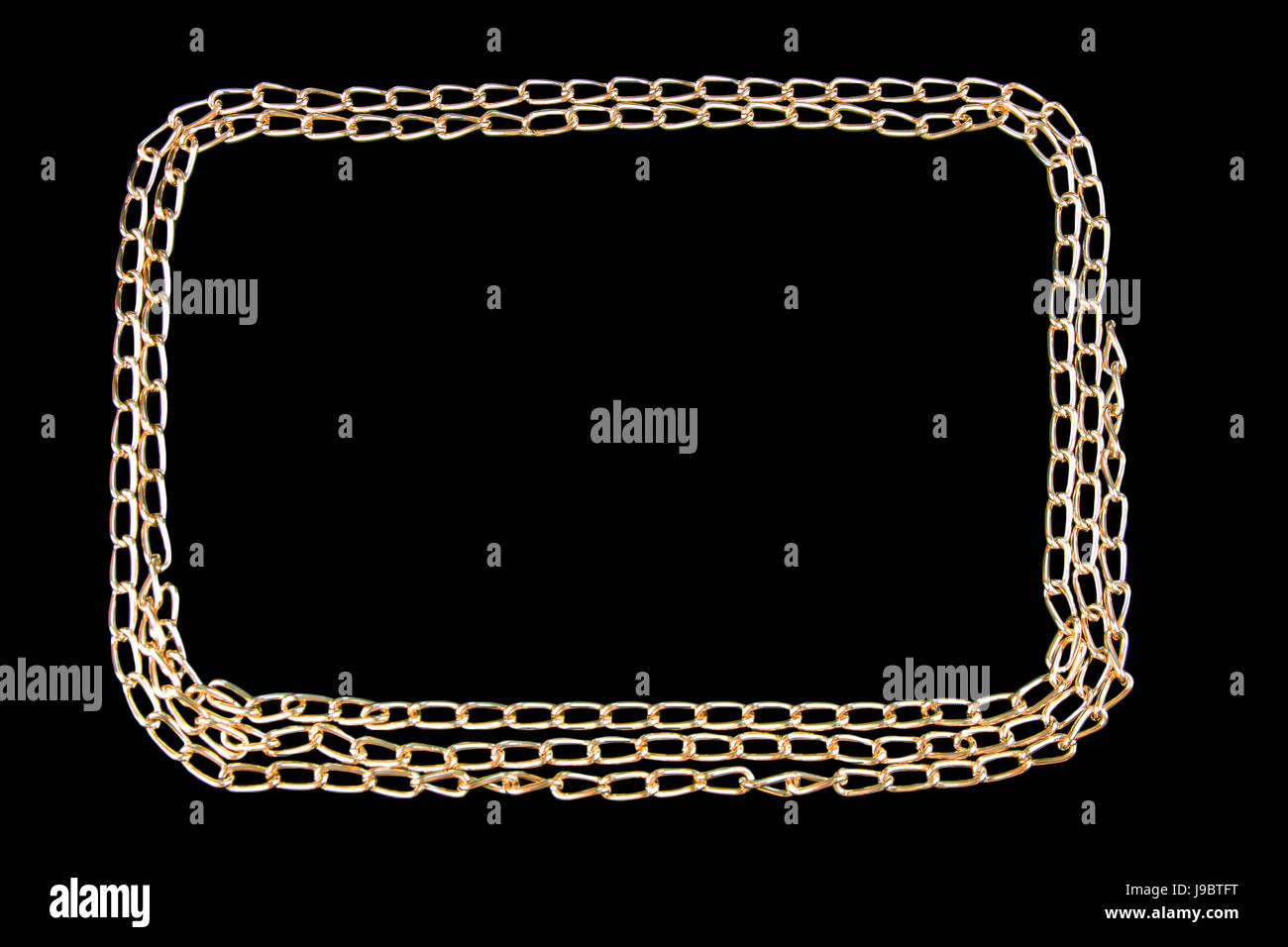 gilded chainlet on a black background Stock Photo - Alamy