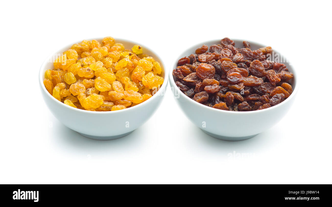 Sweet dried raisins in bowl isolated on white background Stock Photo ...