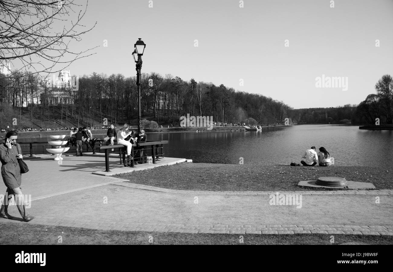 The first warm spring day. Many people left the house to walk in city ...