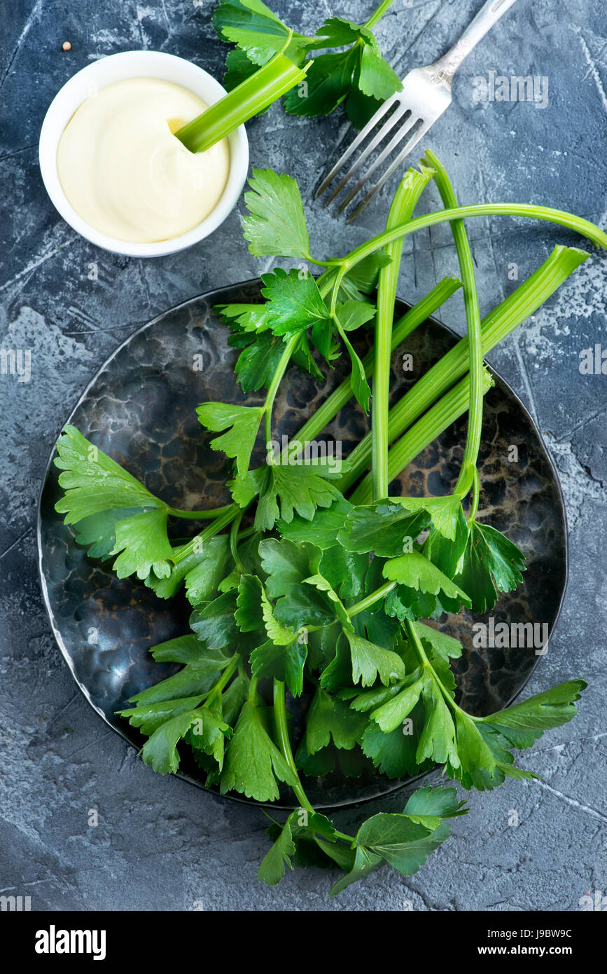 fresh celery and sauce in bowl, stock photo Stock Photo - Alamy