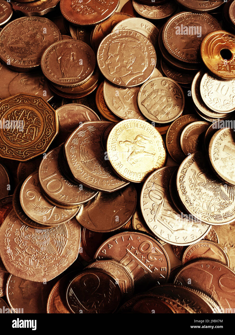 Multiple International Coins Stock Photo - Alamy