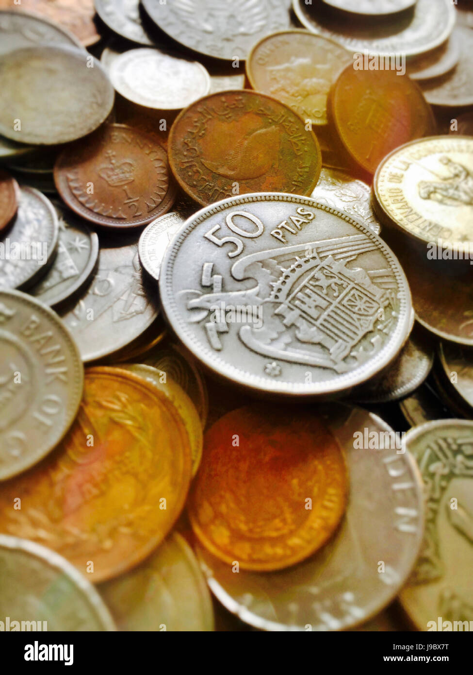 Multiple International Coins Stock Photo - Alamy