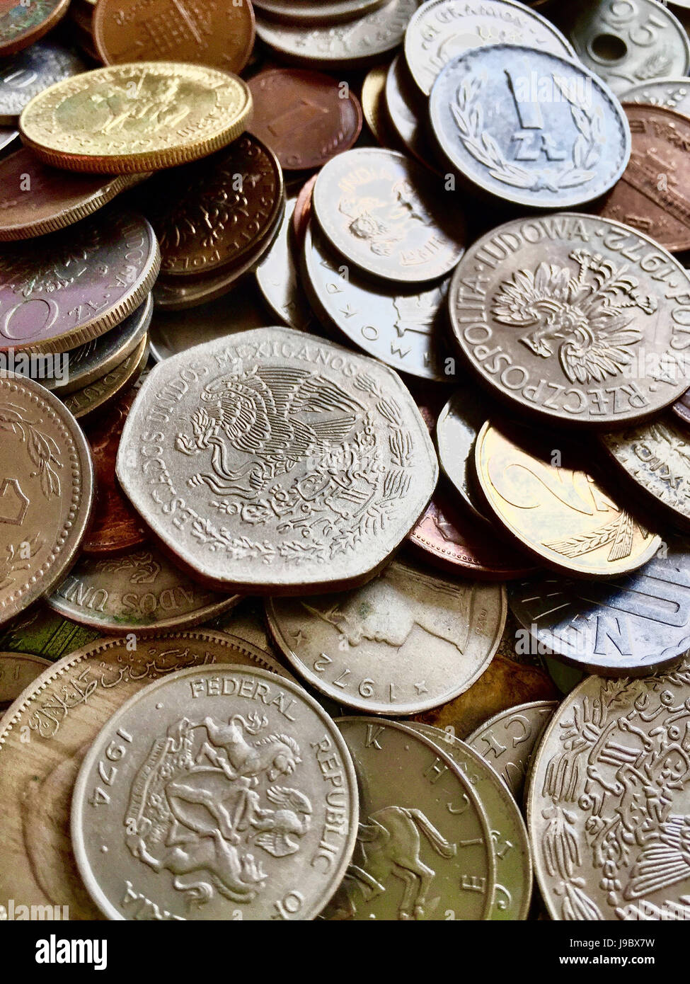 Multiple International Coins Stock Photo - Alamy