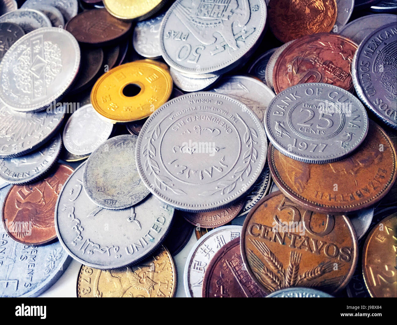 Multiple International Coins Stock Photo - Alamy