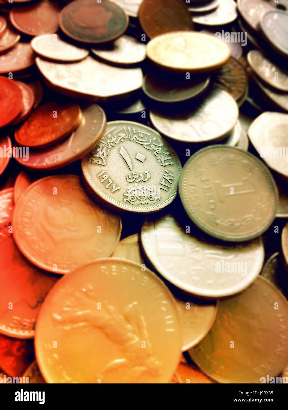 Multiple International Coins Stock Photo - Alamy