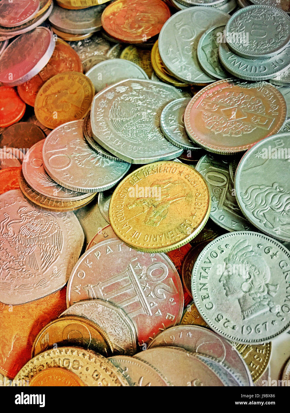 Multiple International Coins Stock Photo - Alamy