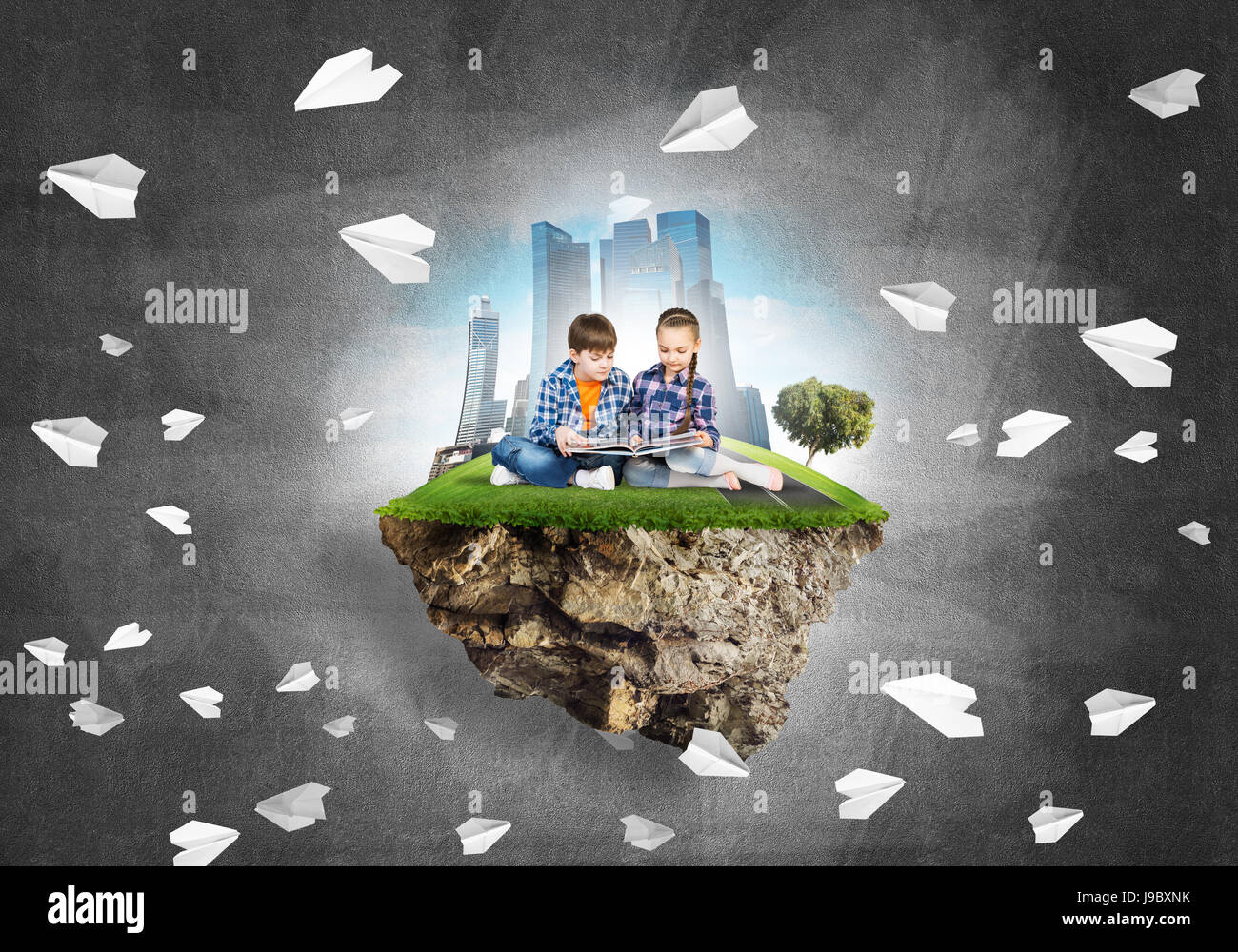 Two kids of school age with book exploring this great world Stock Photo ...