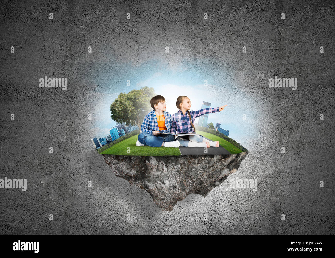 Two kids of school age with book exploring this great world Stock Photo ...