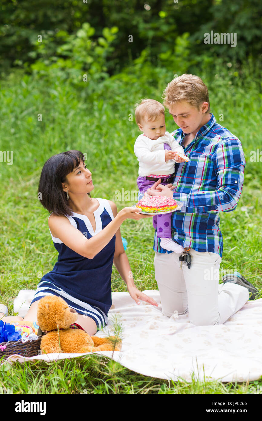 Happy Mixed Race Family Having a Picnic and Playing In The Park Stock ...