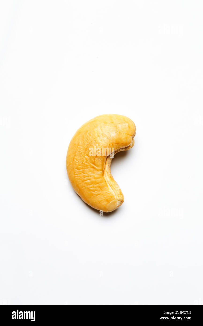 One cashew nut close-up isolated on a white background Stock Photo - Alamy