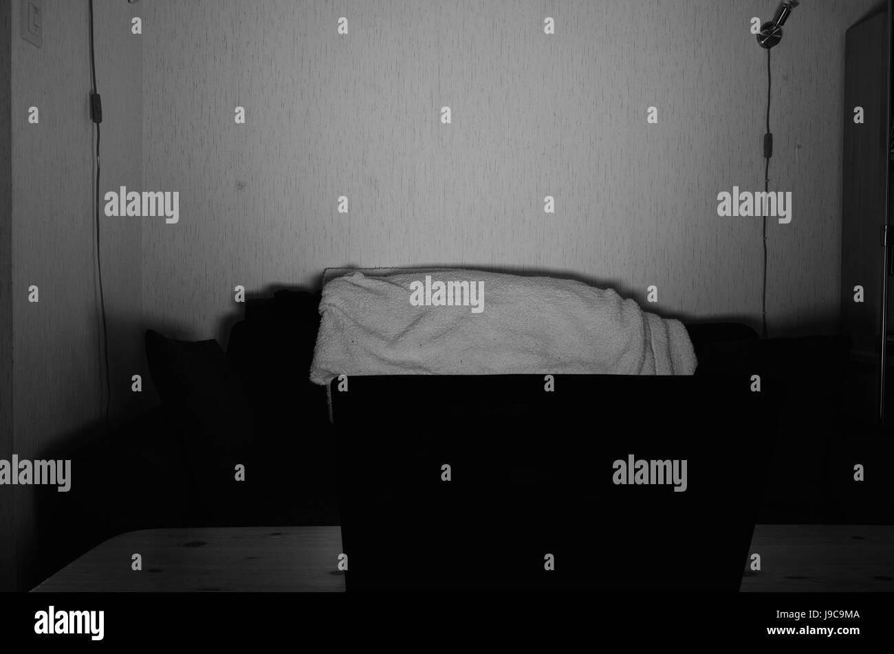 Computer screen illuminating room at night Stock Photo - Alamy