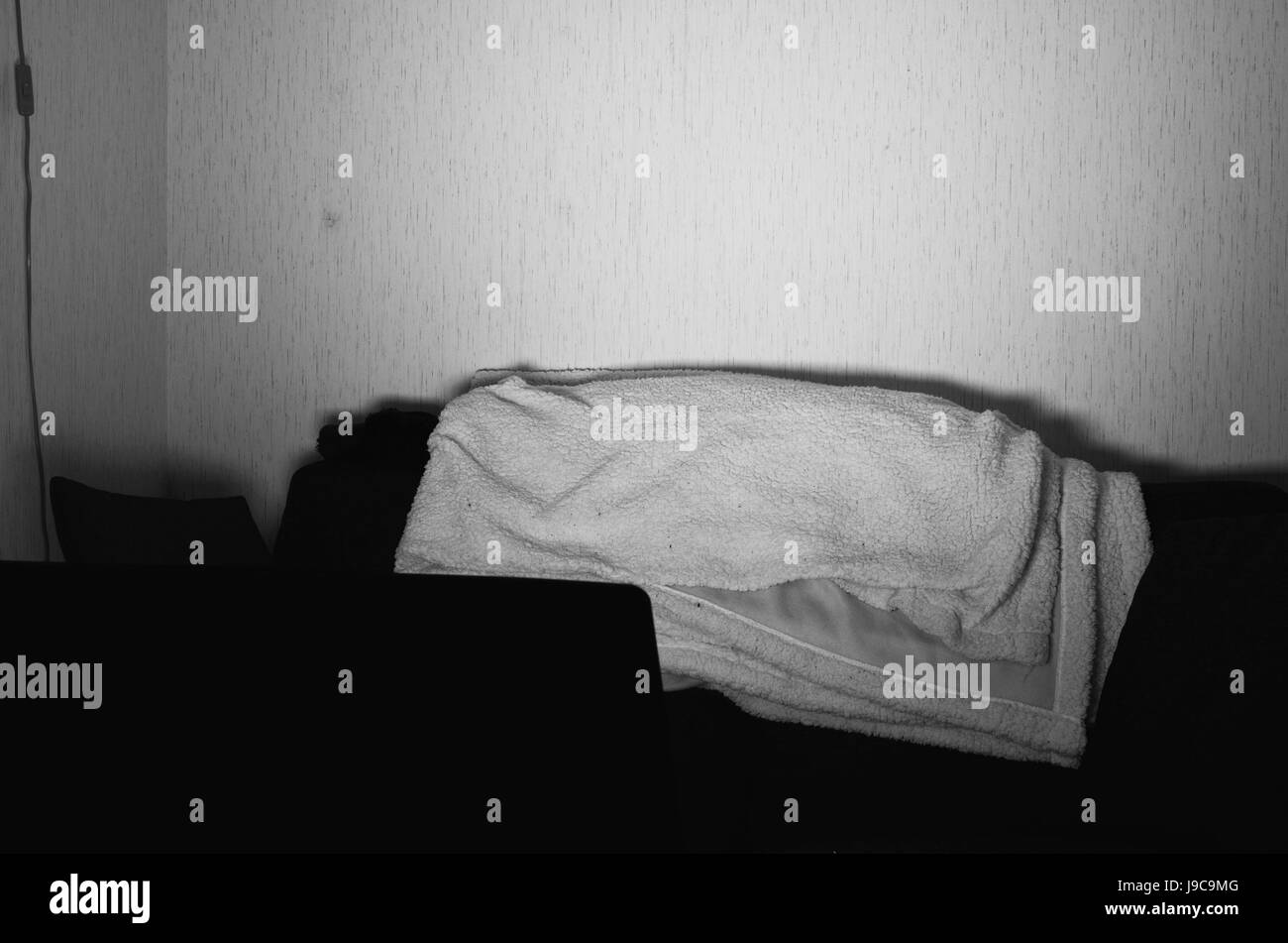 Computer screen illuminating room at night Stock Photo - Alamy