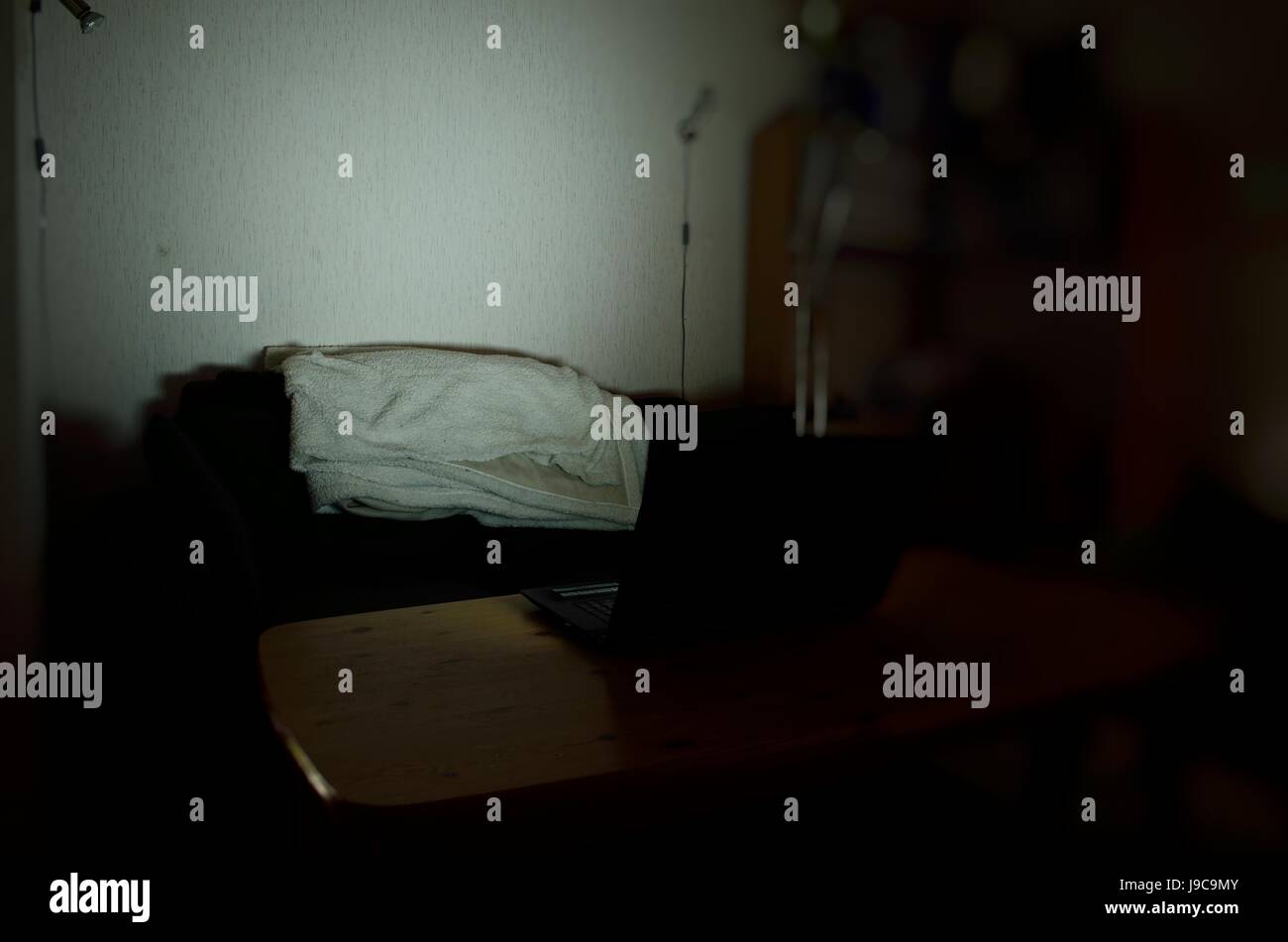 Computer screen illuminating room at night Stock Photo - Alamy