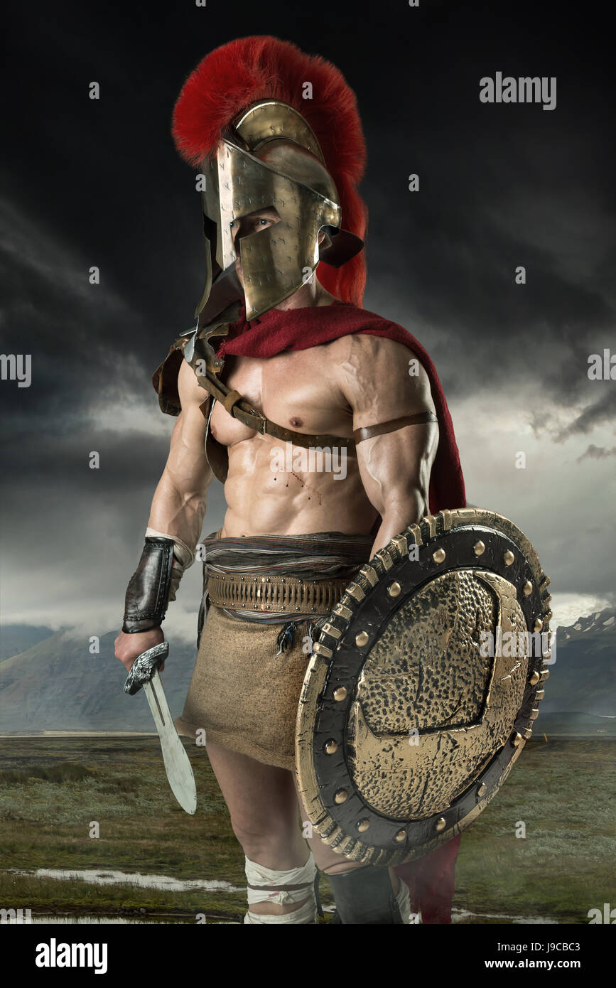 Ancient warrior or Gladiator posing outdoors with helmet Stock Photo ...