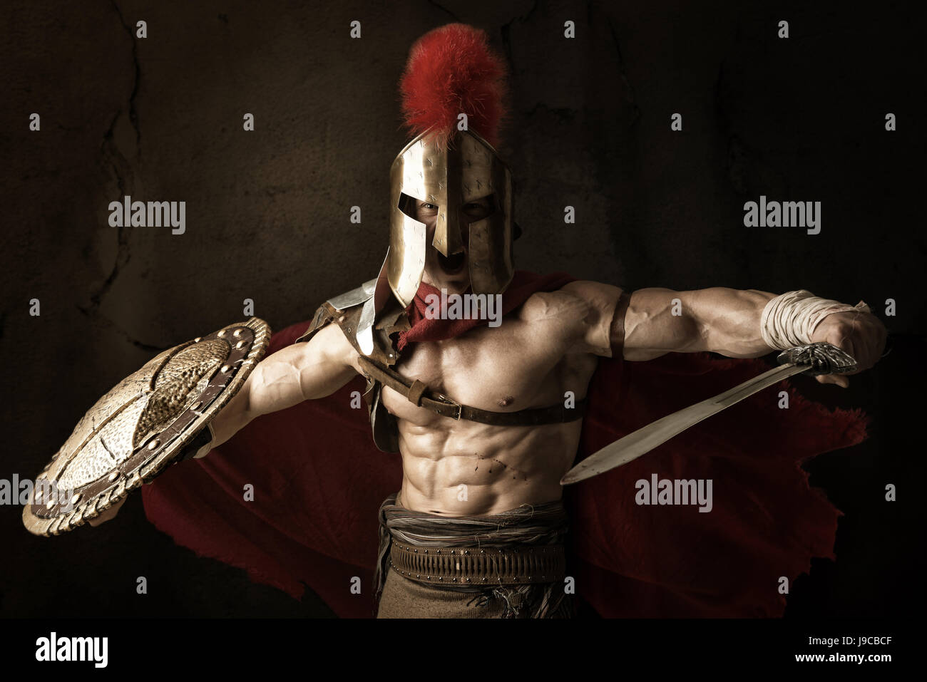 Ancient warrior or Gladiator posing over a dark background Stock Photo ...