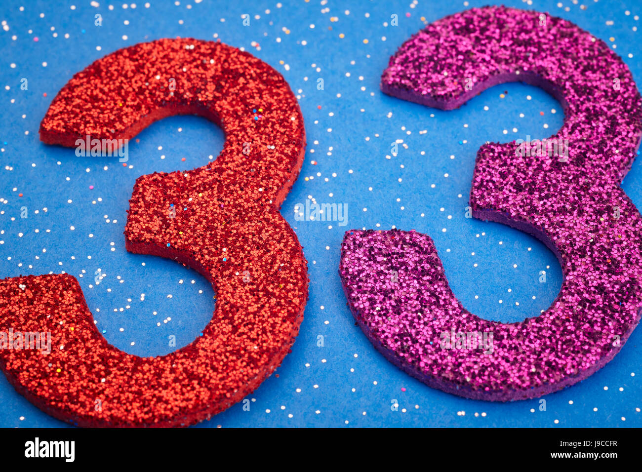 Number thirtythree red purple color over a blue background. Anniversary ...