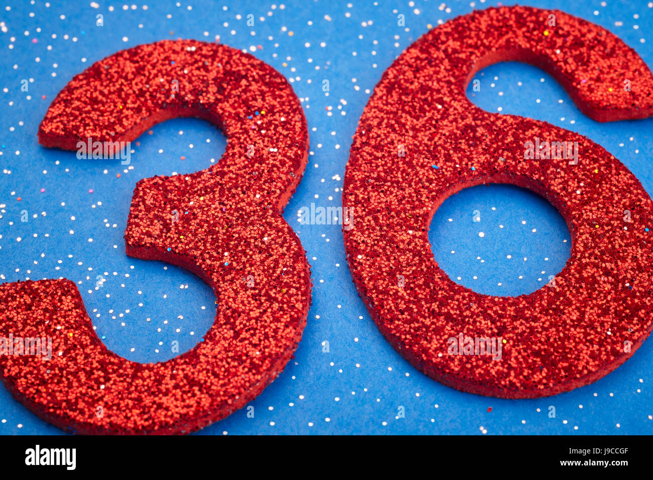 Number thirtysix red color over a blue background. Anniversary ...