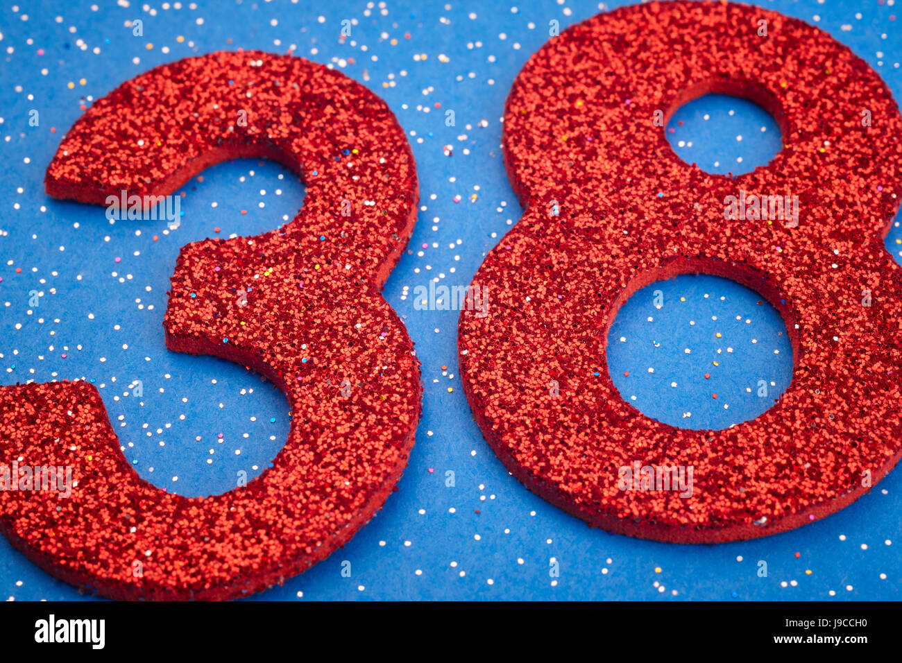 Number thirtyeight red color over a blue background. Anniversary Stock ...