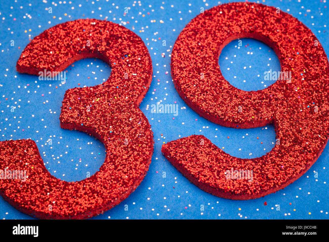 Number thirtynine red color over a blue background. Anniversary ...