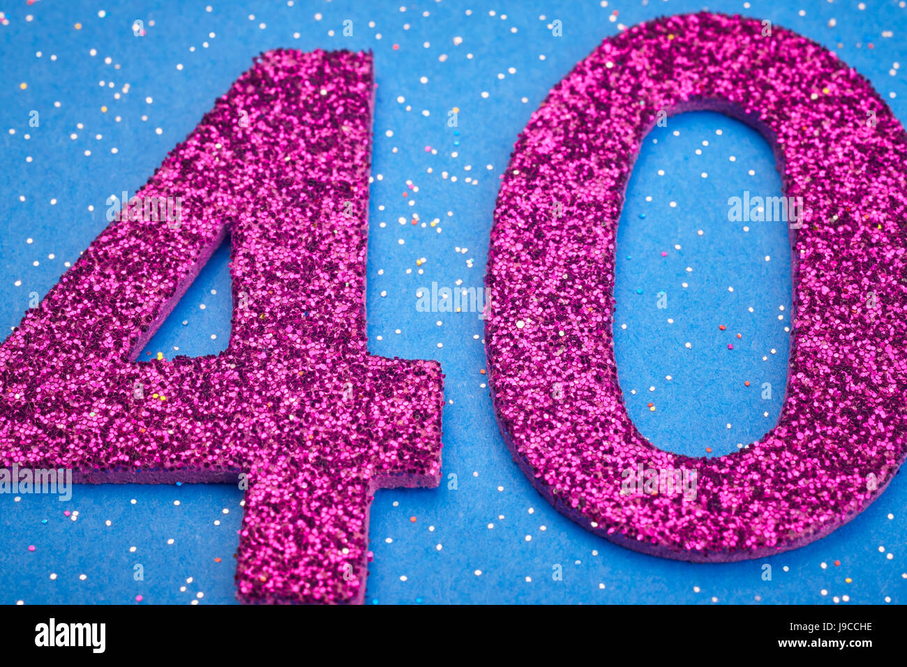Number forty purple color over a blue background. Anniversary ...