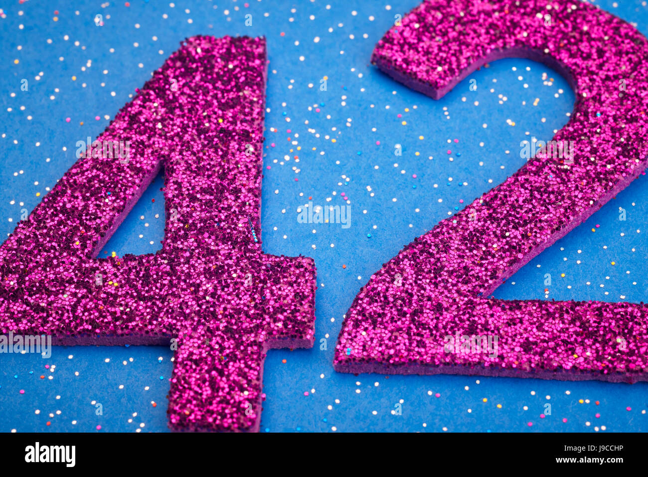 Number fortytwo purple color over a blue background. Anniversary ...