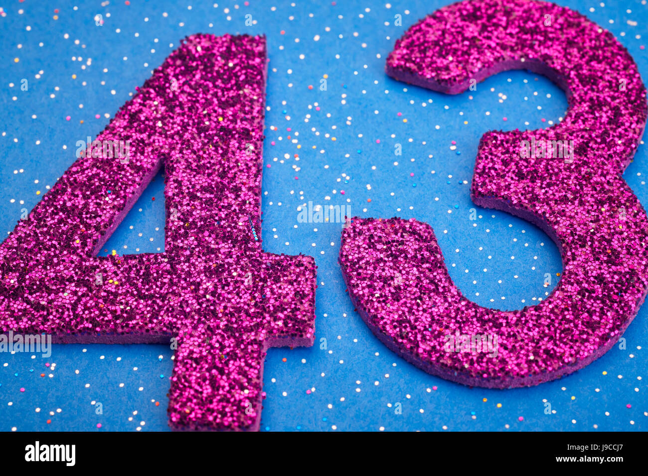 Number fortythree purple color over a blue background. Anniversary ...