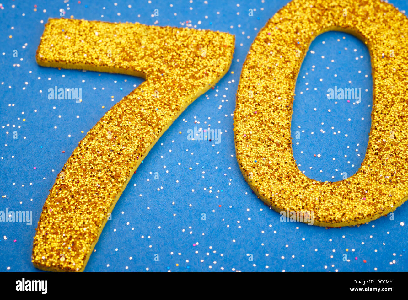 Number seventy yellow color over a blue background. Anniversary ...