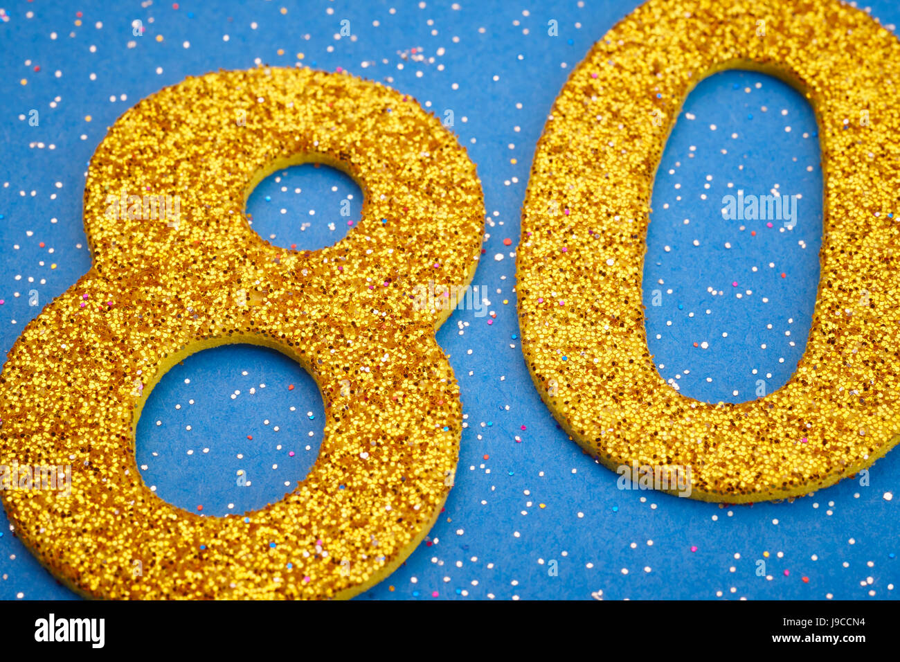 Number eighty yellow color over a blue background. Anniversary ...