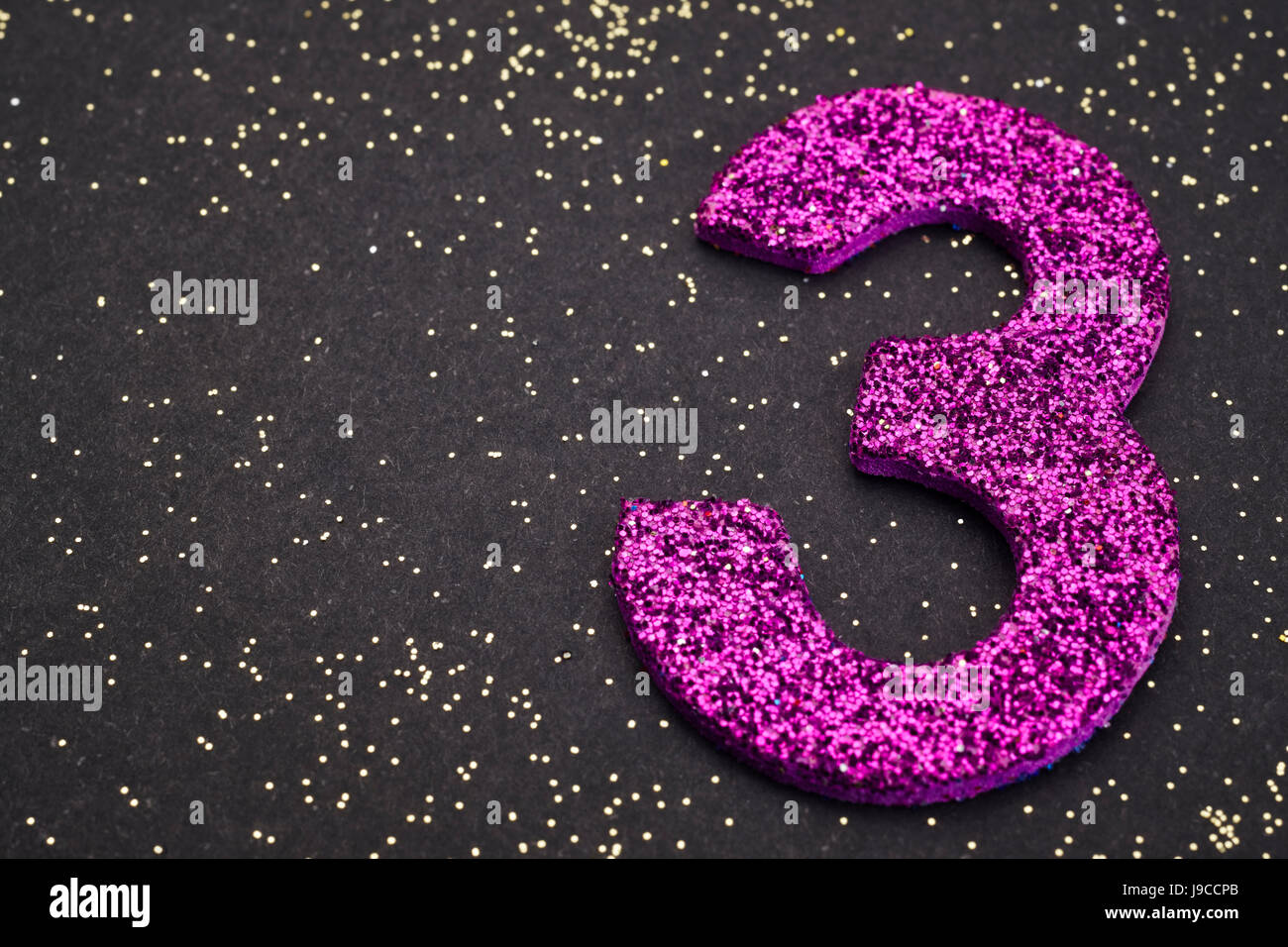 Number three purple color over a black background. Anniversary ...