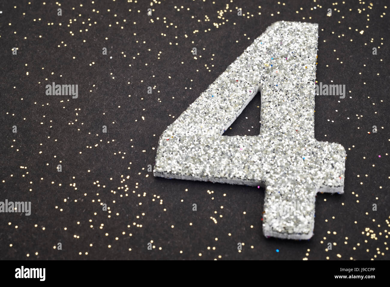 Number four silver color over a black background. Anniversary ...
