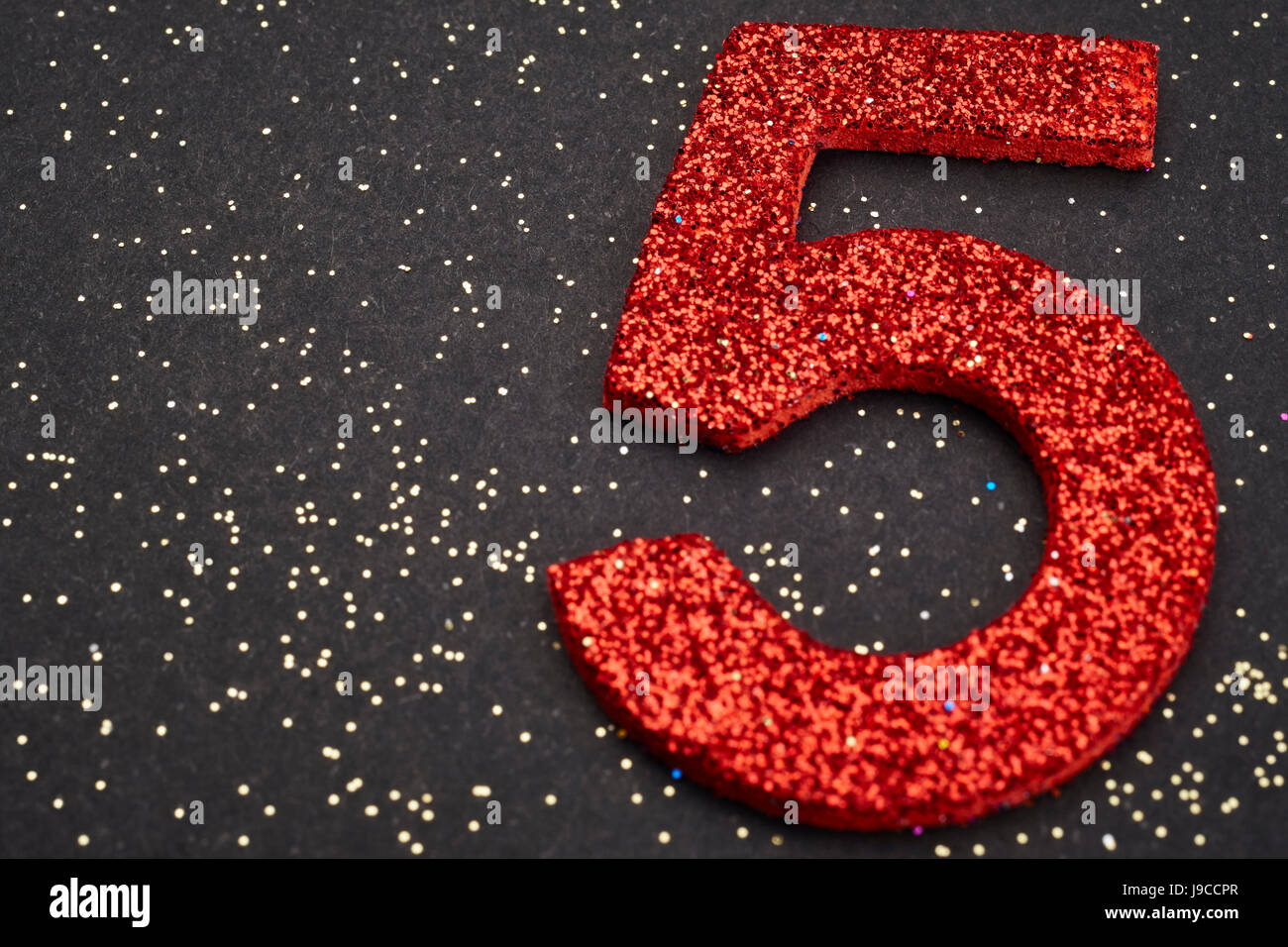 Number five red color over a black background. Anniversary. Horizontal ...