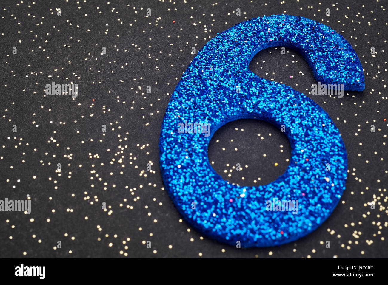 Number six blue color over a black background. Anniversary. Horizontal ...