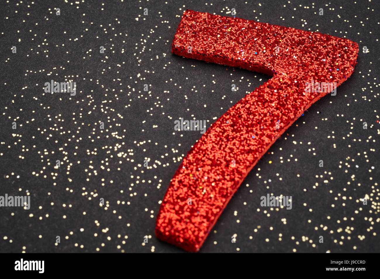 Number seven red color over a black background. Anniversary. Horizontal ...