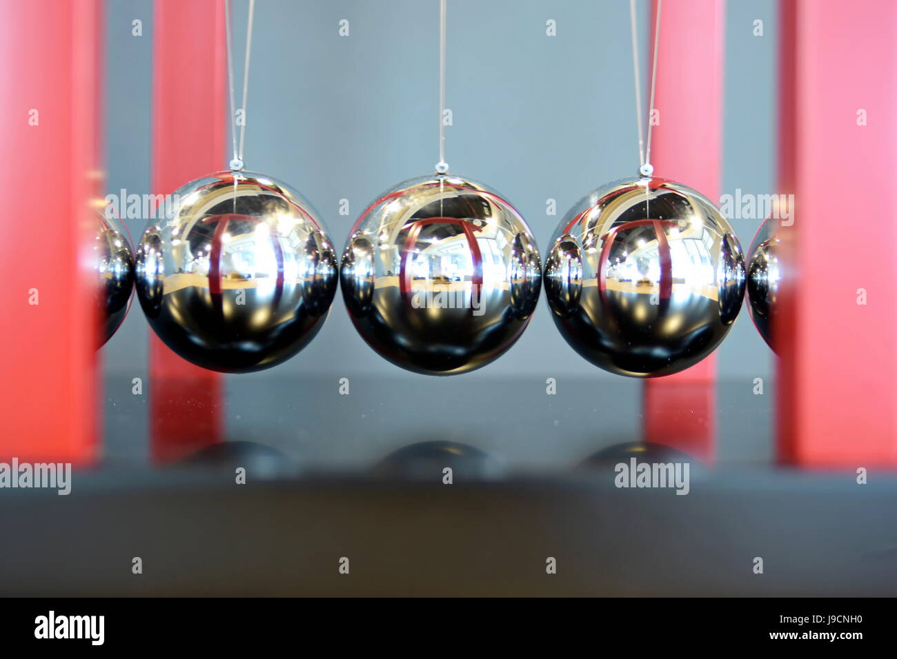 Close-up 5 Balls Pendulum, Newton's cradle, in different angels Stock ...