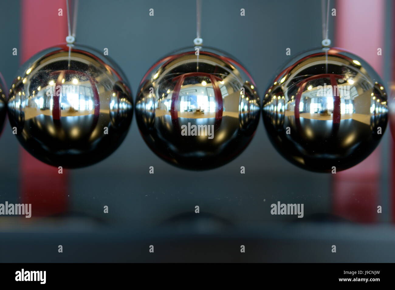 Close-up 5 Balls Pendulum, Newton's cradle, in different angels Stock ...