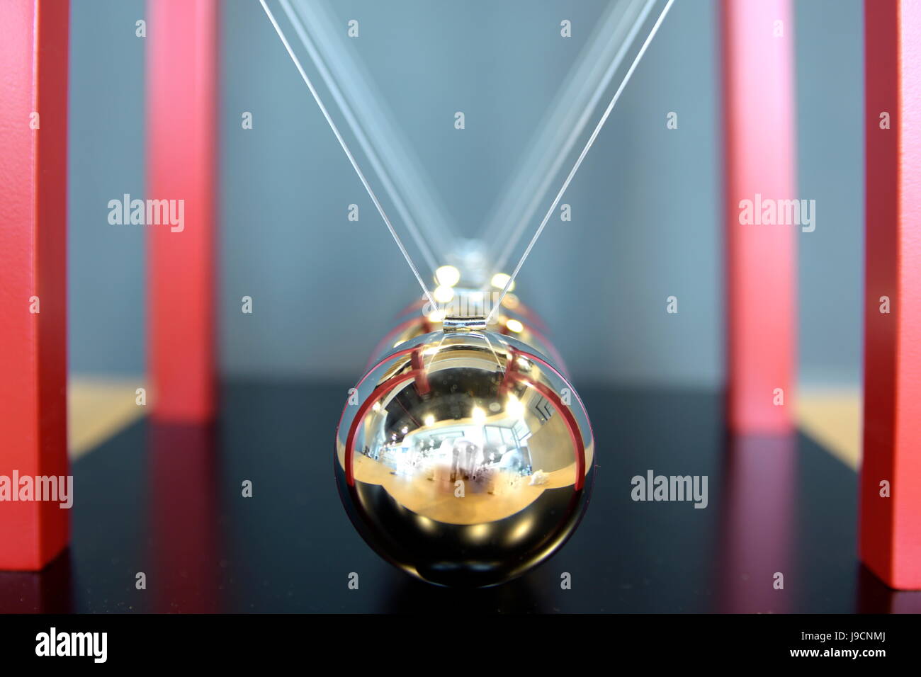 Close-up 5 Balls Pendulum, Newton's cradle, in different angels Stock ...