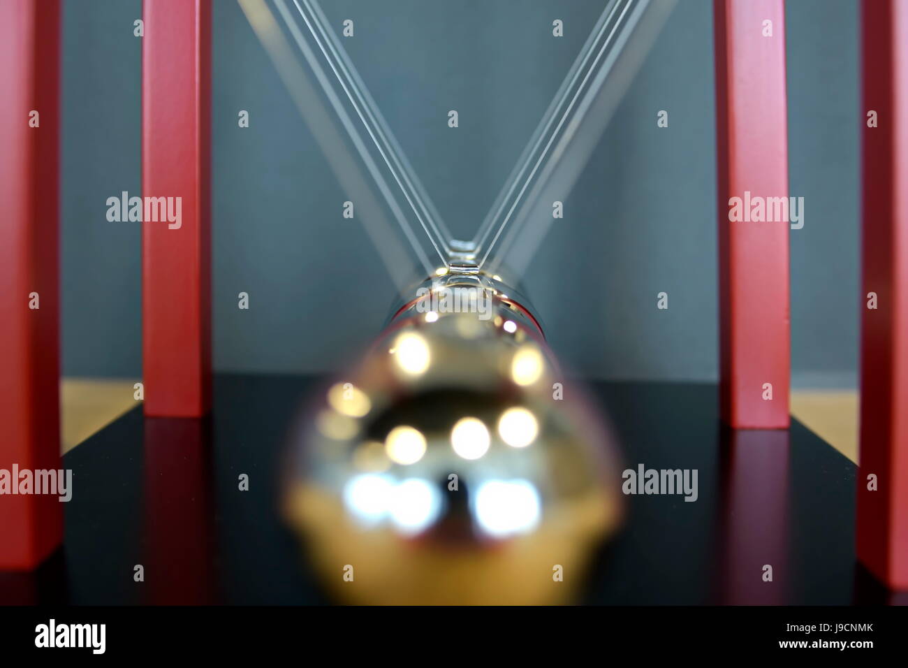 Close-up 5 Balls Pendulum, Newton's cradle, in different angels Stock ...