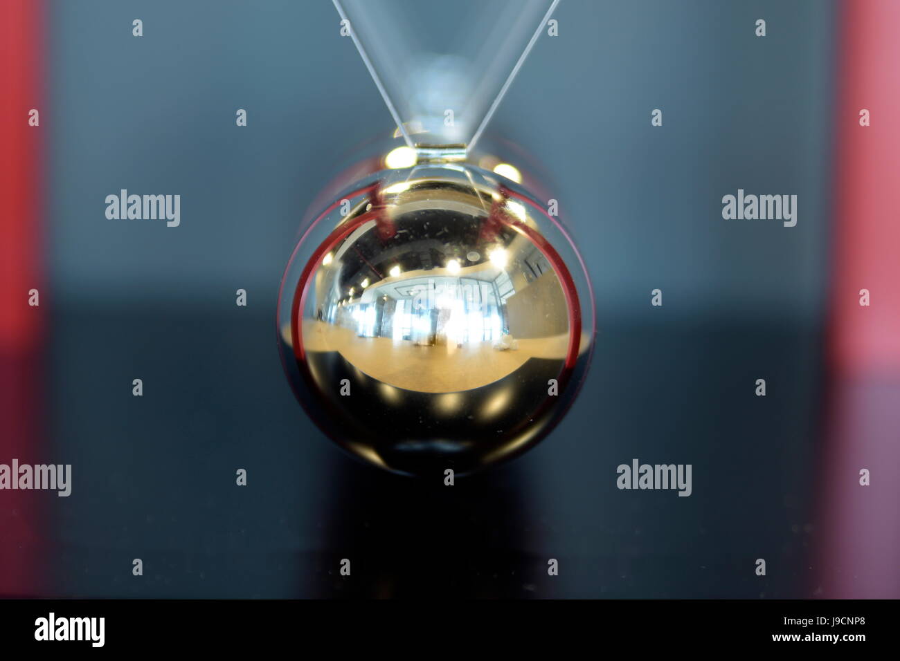 Close-up 5 Balls Pendulum, Newton's cradle, in different angels Stock ...