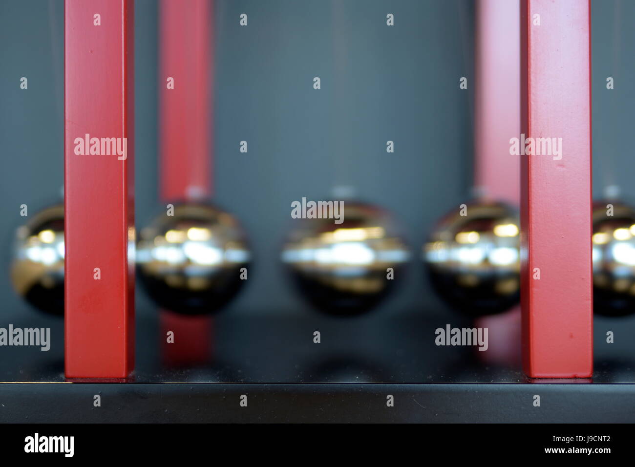 Close-up 5 Balls Pendulum, Newton's cradle, in different angels Stock ...