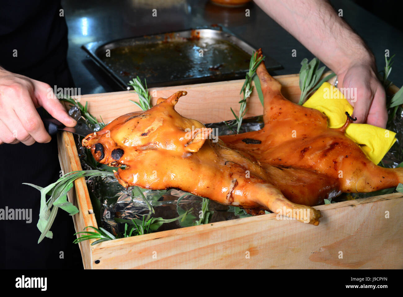 chef preparing roast piglet Stock Photo - Alamy