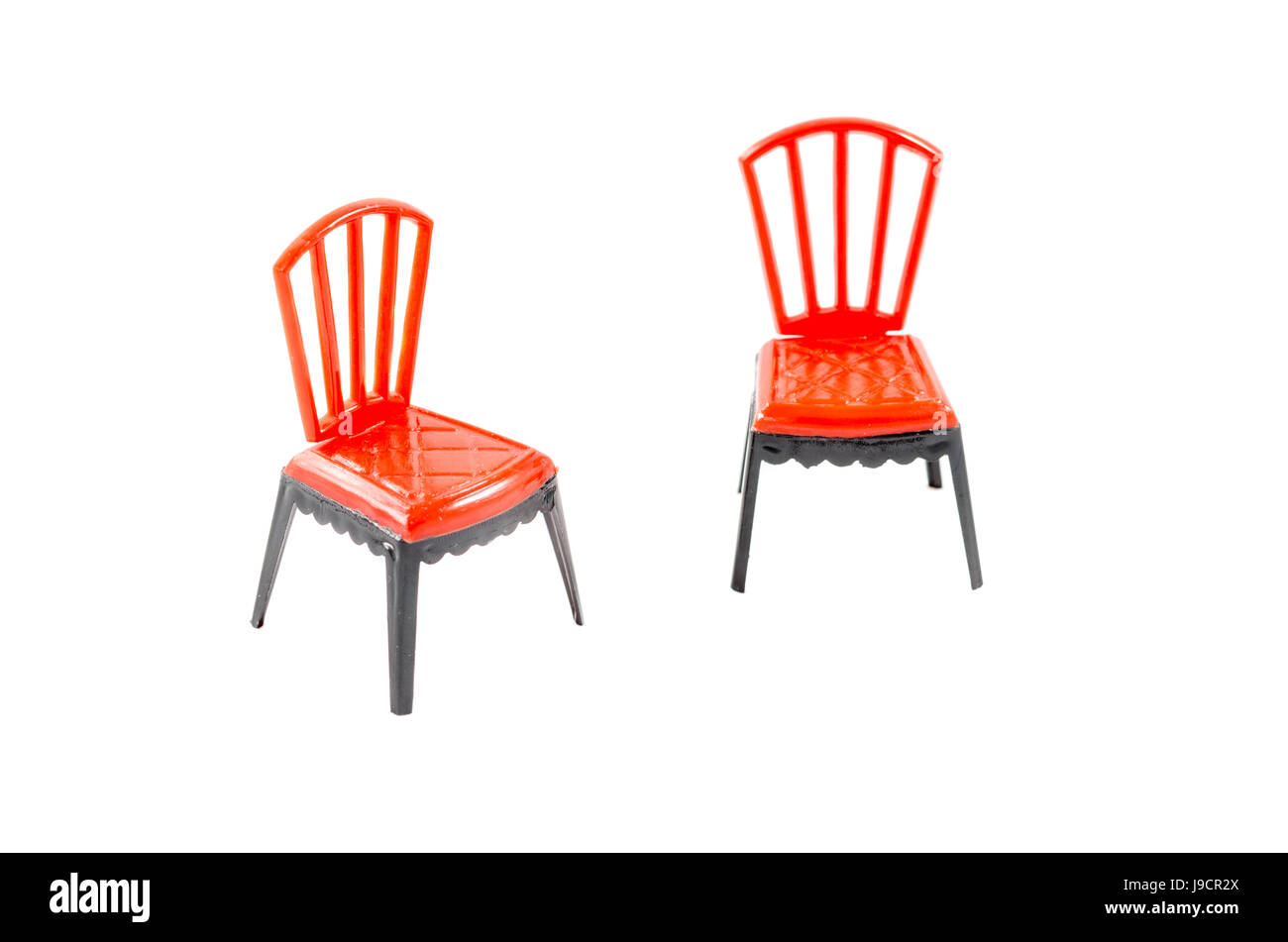 Red plastic chair isolated on white background Stock Photo - Alamy