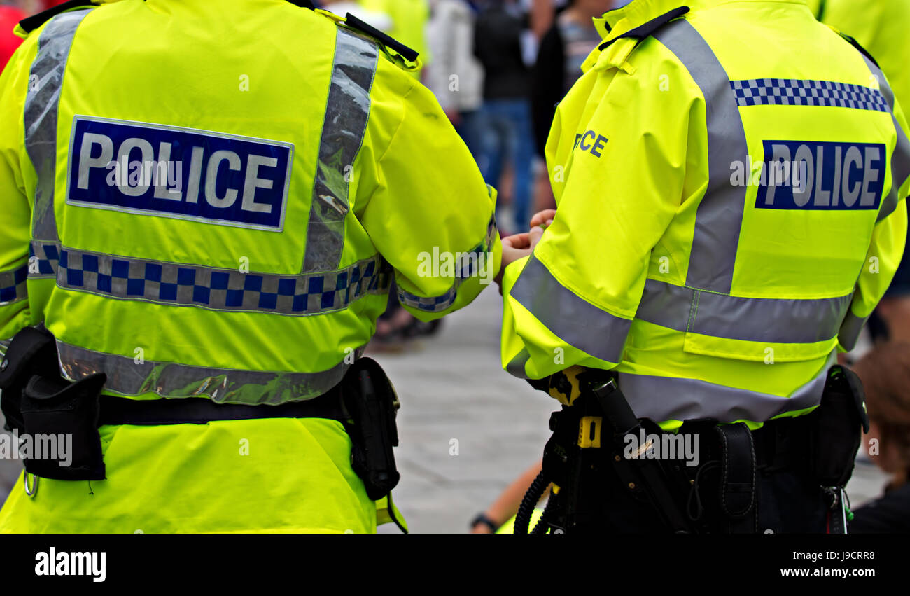 British Police Officers in high visibility uniform on crowd control ...