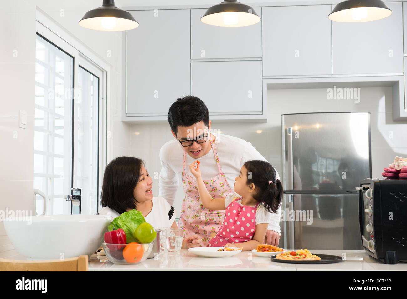 asian family cooking at kitchen Stock Photo - Alamy