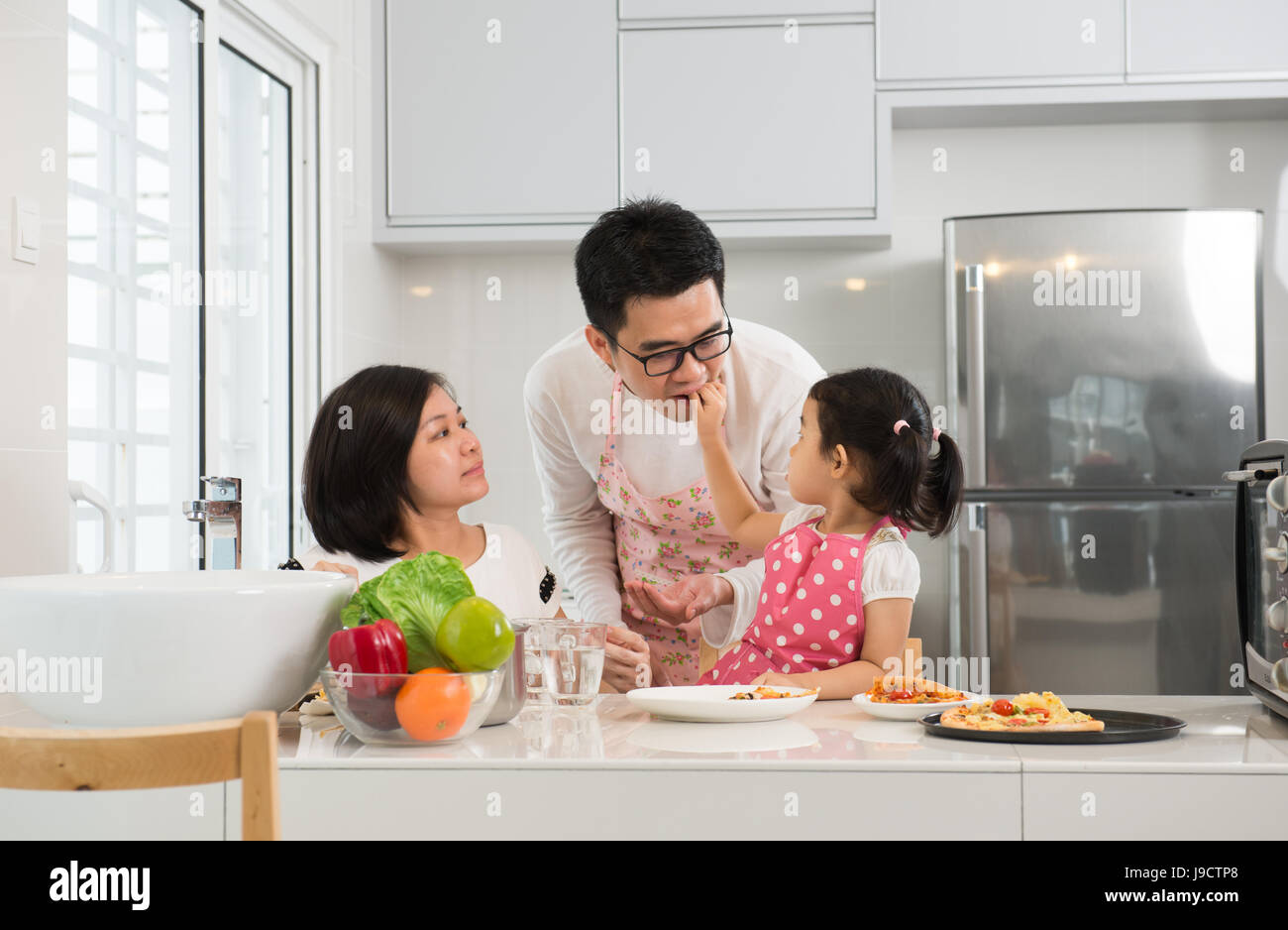 asian family cooking at kitchen Stock Photo - Alamy