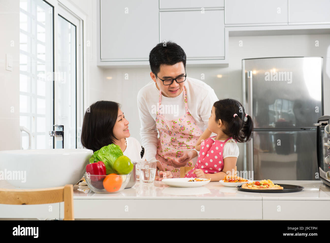 asian family cooking at kitchen Stock Photo - Alamy